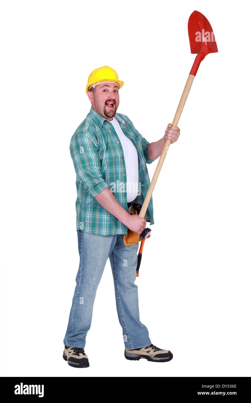 Happy man holding shovel Stock Photo - Alamy