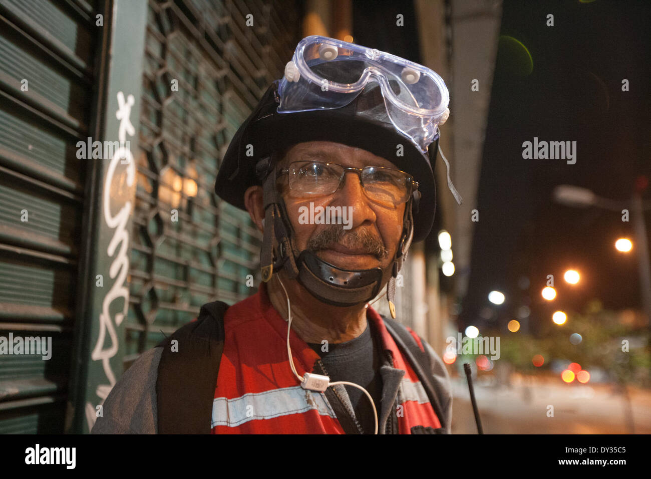 Caracas, Venezuela. 4th Apr, 2014. A paramedic stays in a clash between ...