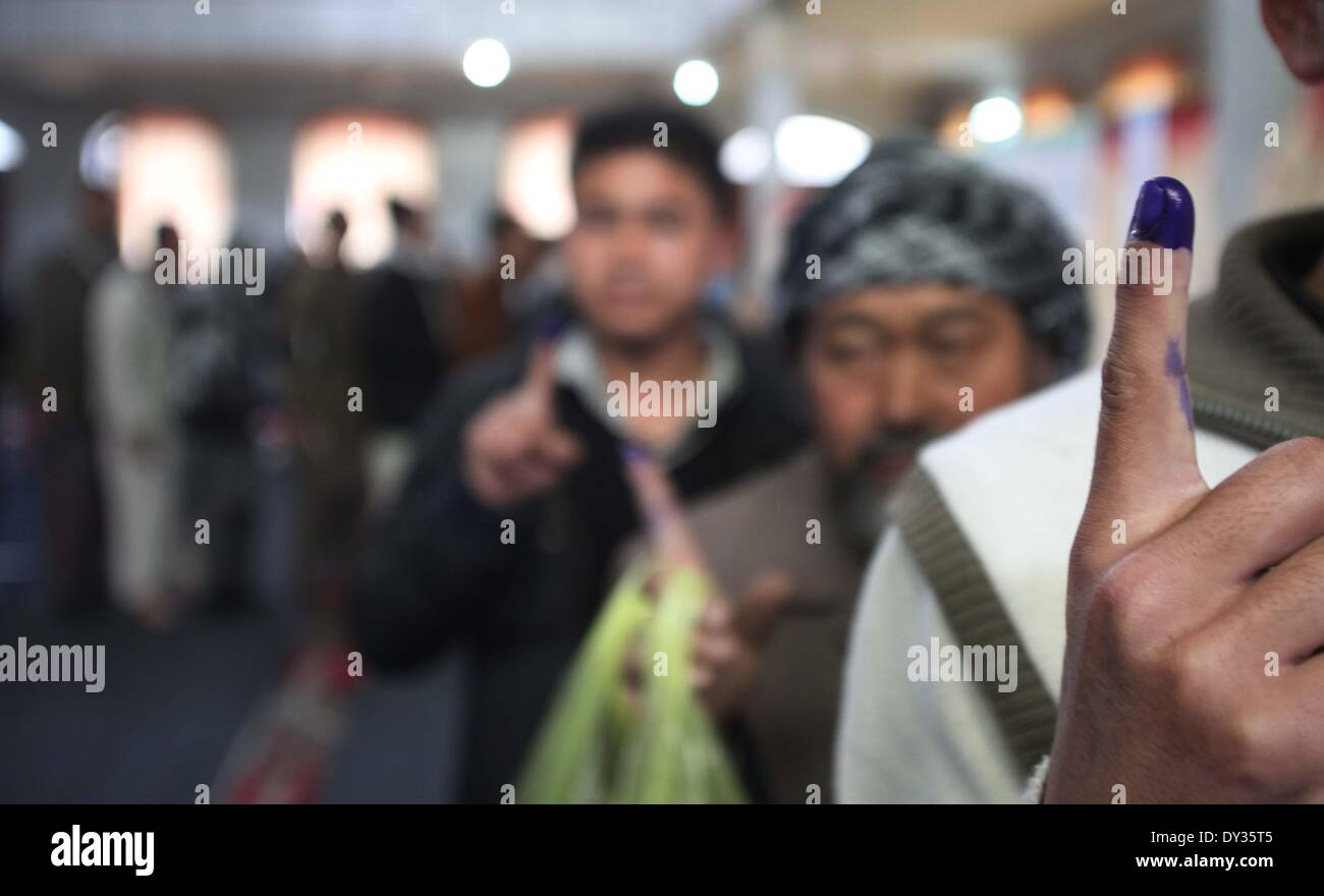 Kabul, Afghanistan. 5th Apr, 2014. An Afghan man shows his inked finger ...