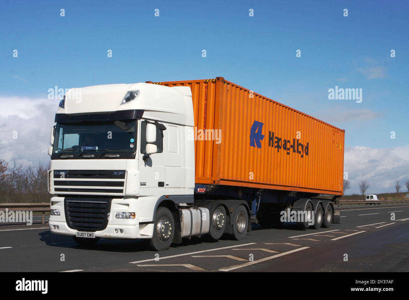 A Hapag LLoyd shipping container being driven along the A46 dual Stock ...