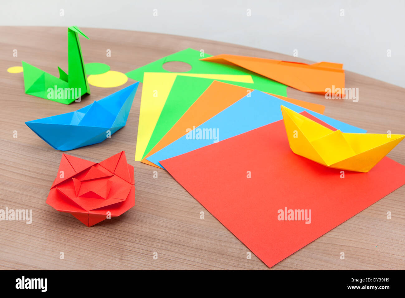 colorful paper lying on a table to fold of objects Stock Photo - Alamy