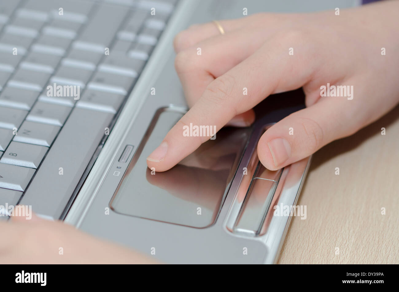 Working on a laptop ,Hand checking schedule on laptop Stock Photo - Alamy