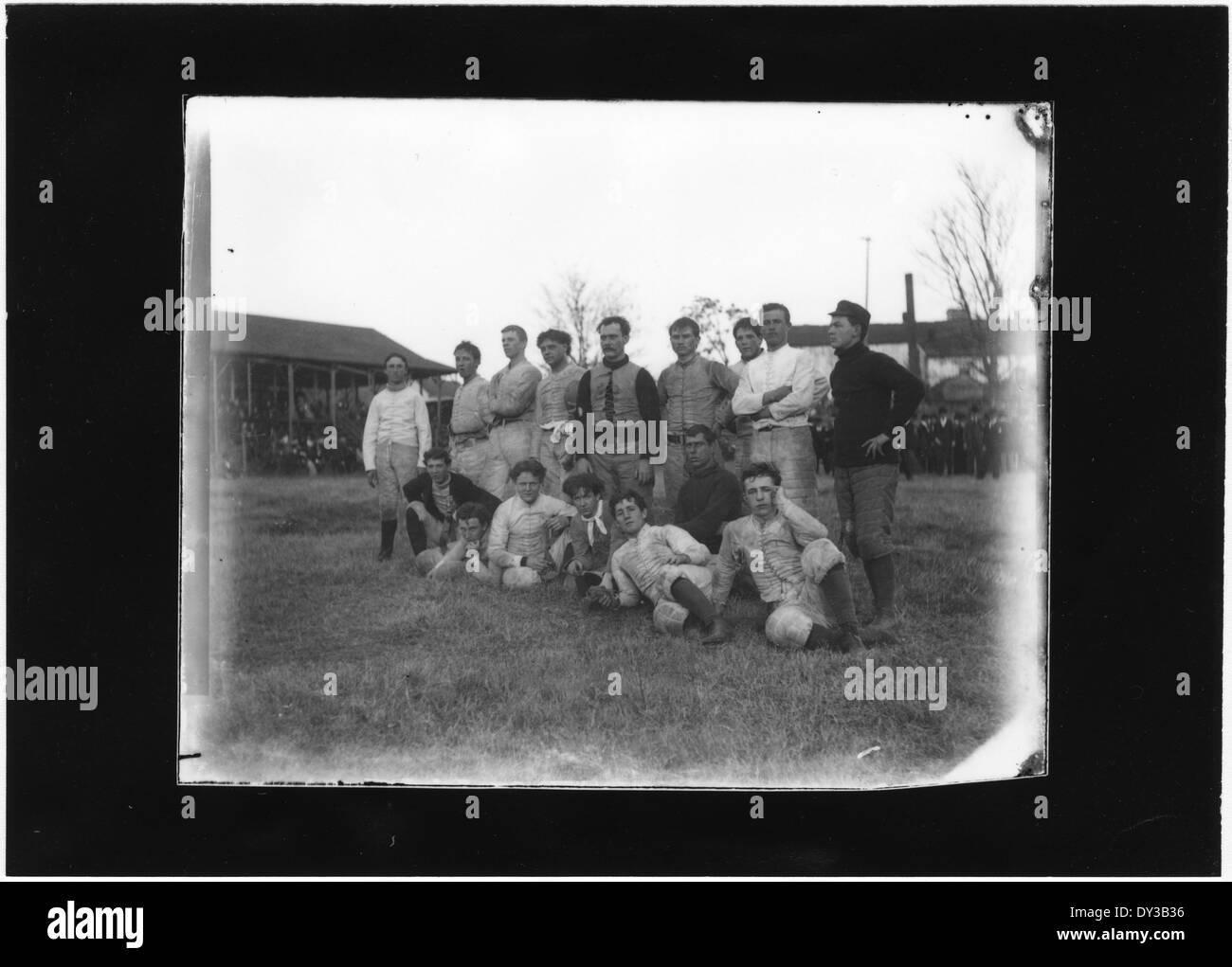 This photograph captures a historical football team, possibly from the ...