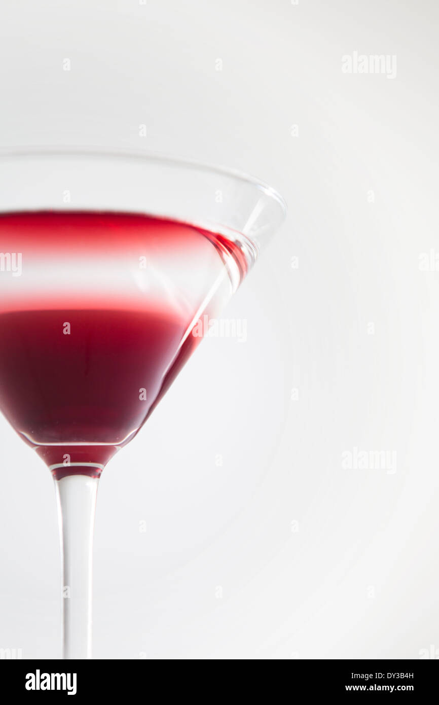 Layered red and transparent cocktail in a martini glass Stock Photo - Alamy