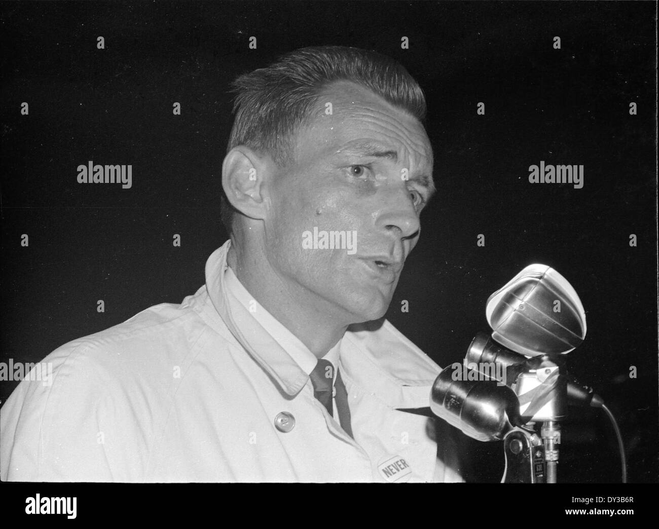 A photograph depicting a Ku Klux Klan rally in 1965, capturing the ...