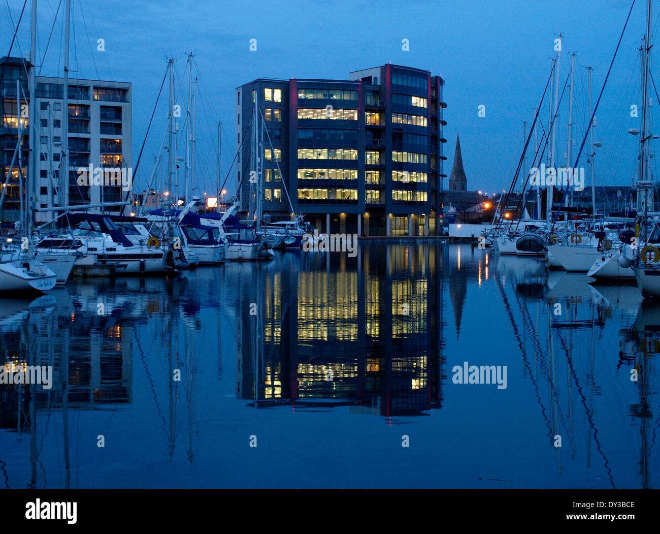 Devon harbour office block lights on reflected reflection reflections ...