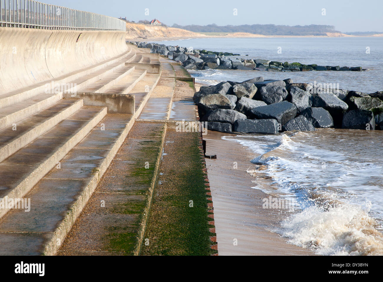 Curved Sea wall, steps and rock armour groynes, forming coastal Stock ...