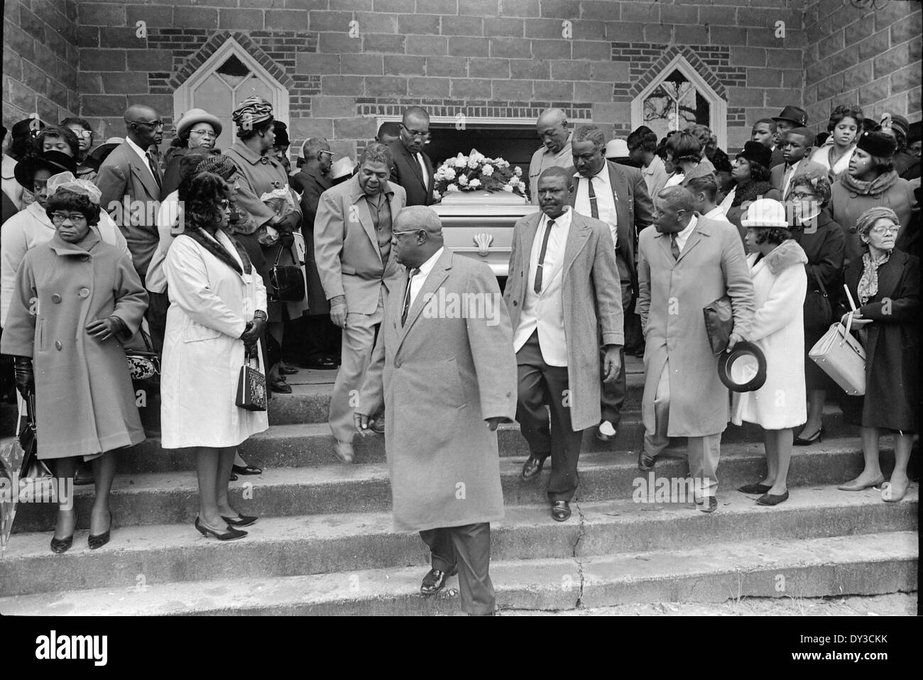 A somber scene from the funeral of Dahmer in January 1966, capturing ...