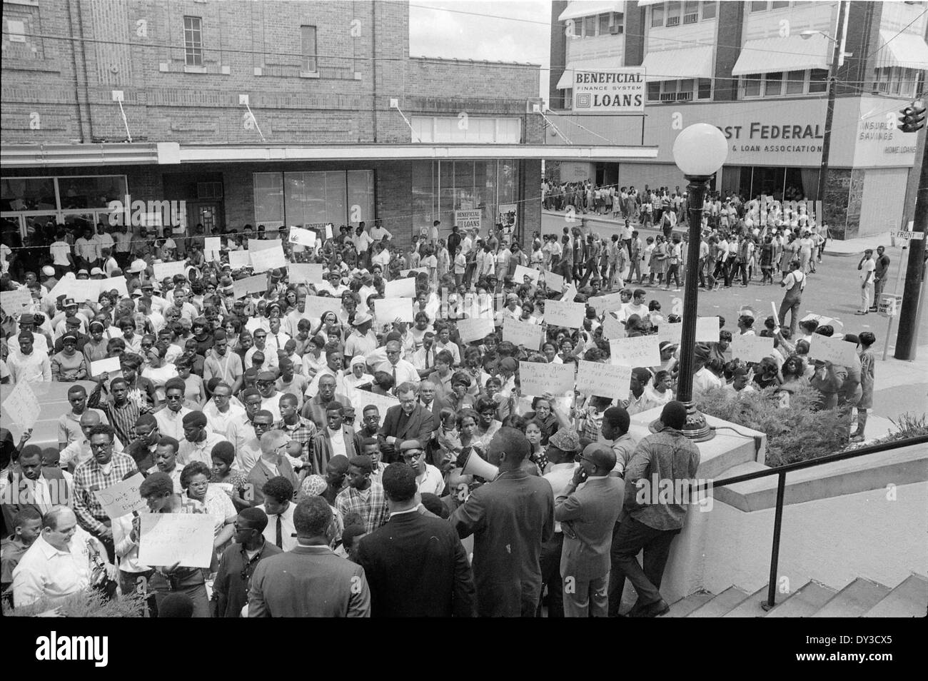 This image shows a significant march led by Dr. Martin Luther King Jr ...