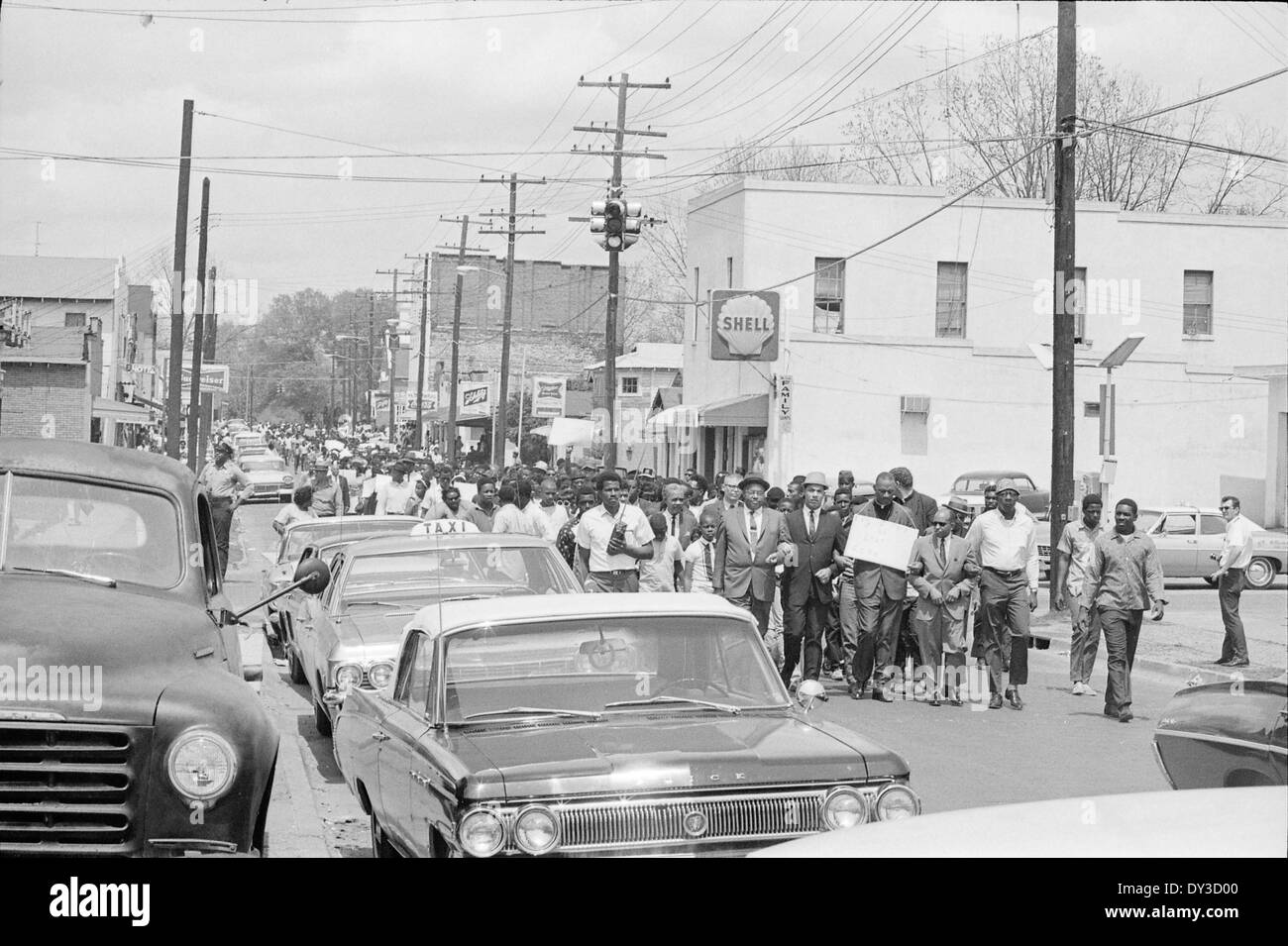 A historical photograph documenting a march led by Dr. Martin Luther ...