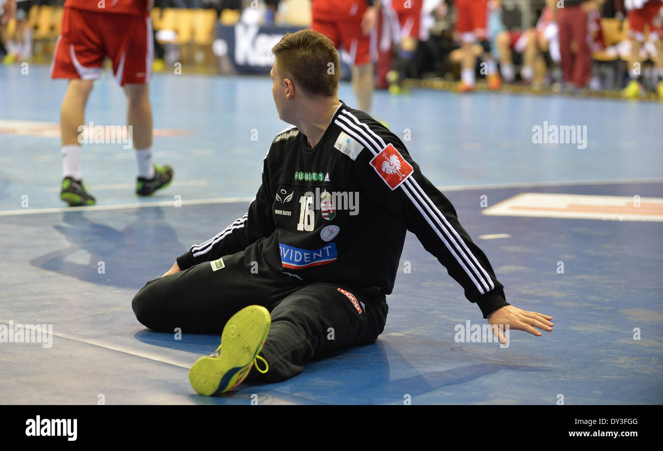 Hungary's goalkeeper sits on the floor after a goal the handball match ...