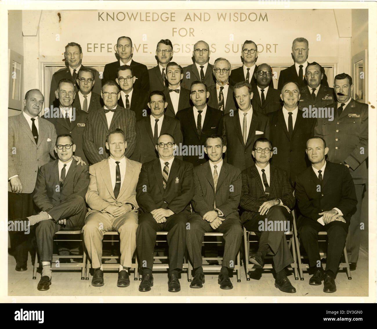 This image features a group of unidentified men, captured in a ...
