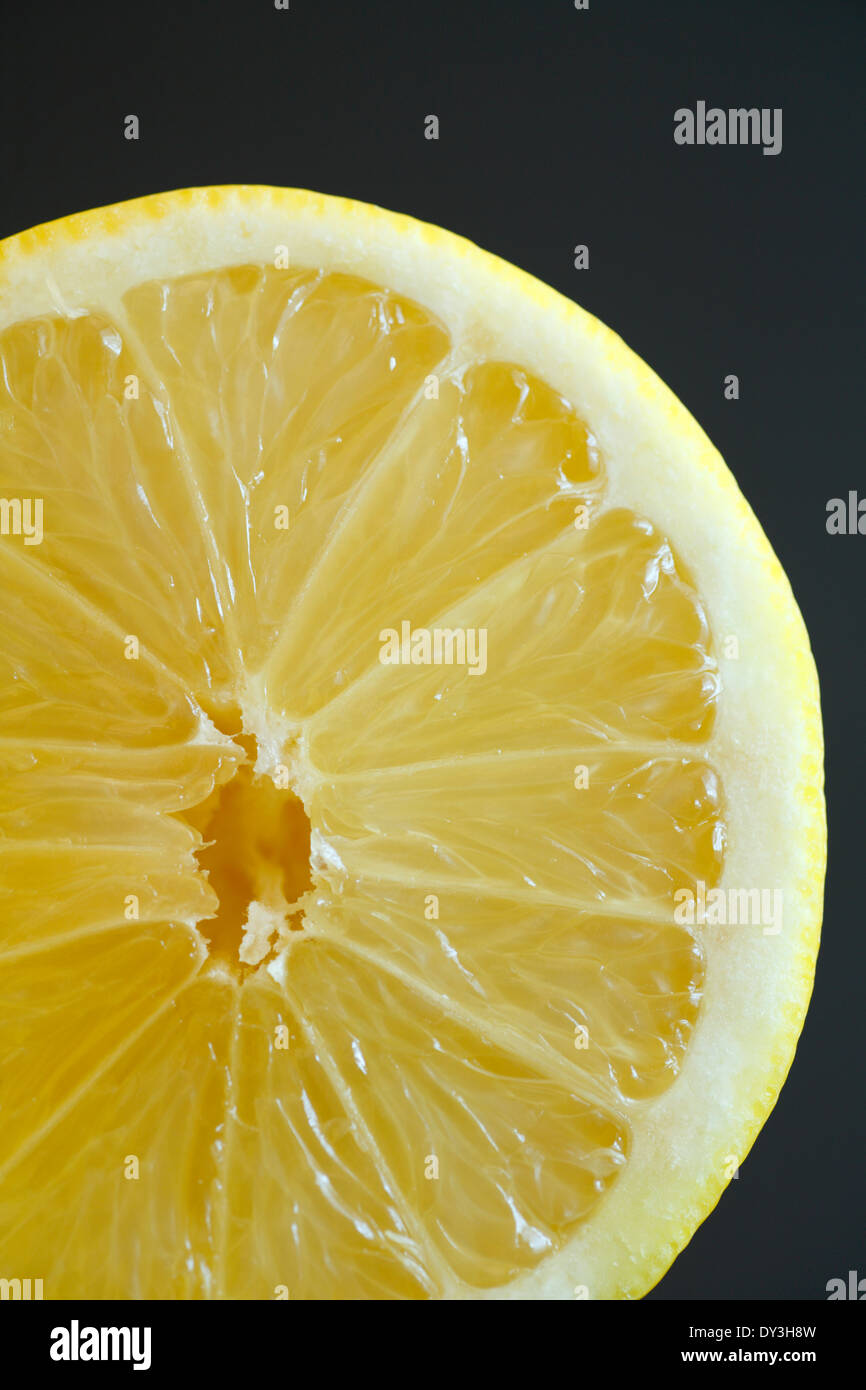 Lemon on dark background Stock Photo - Alamy