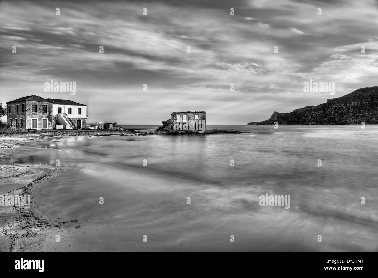 The ruins of a house in the middle of the sea in the village Plytra in ...