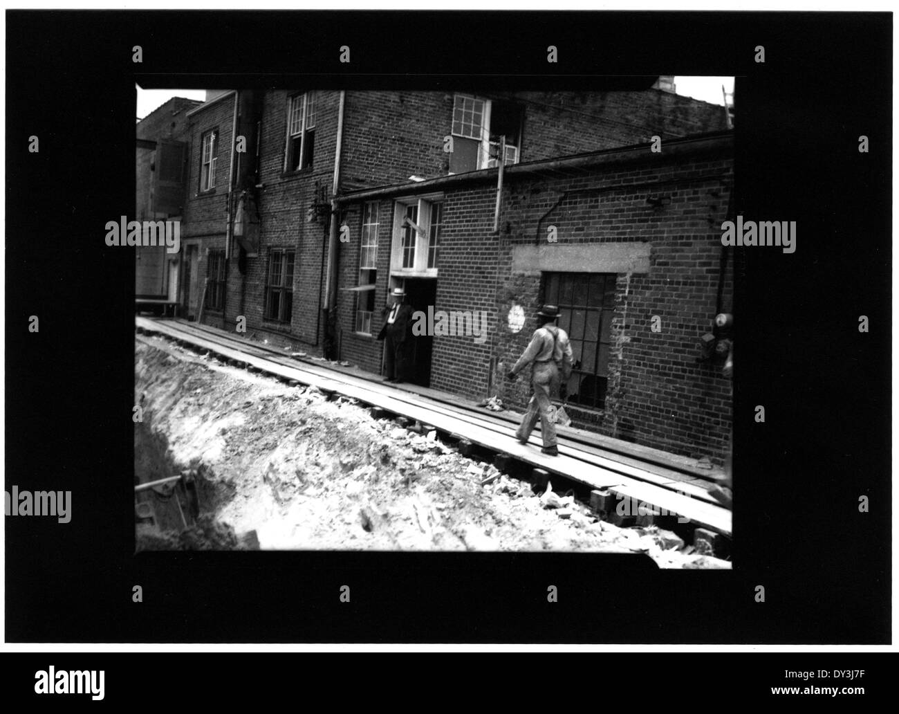 This image shows the loading and unloading of rolls of paper at the H ...