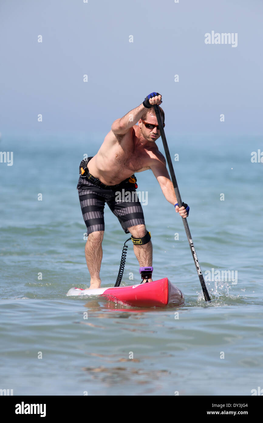 Dunedin, Florida. 05th Apr, 2014. Stand up paddleboarder Adam Pollock ...
