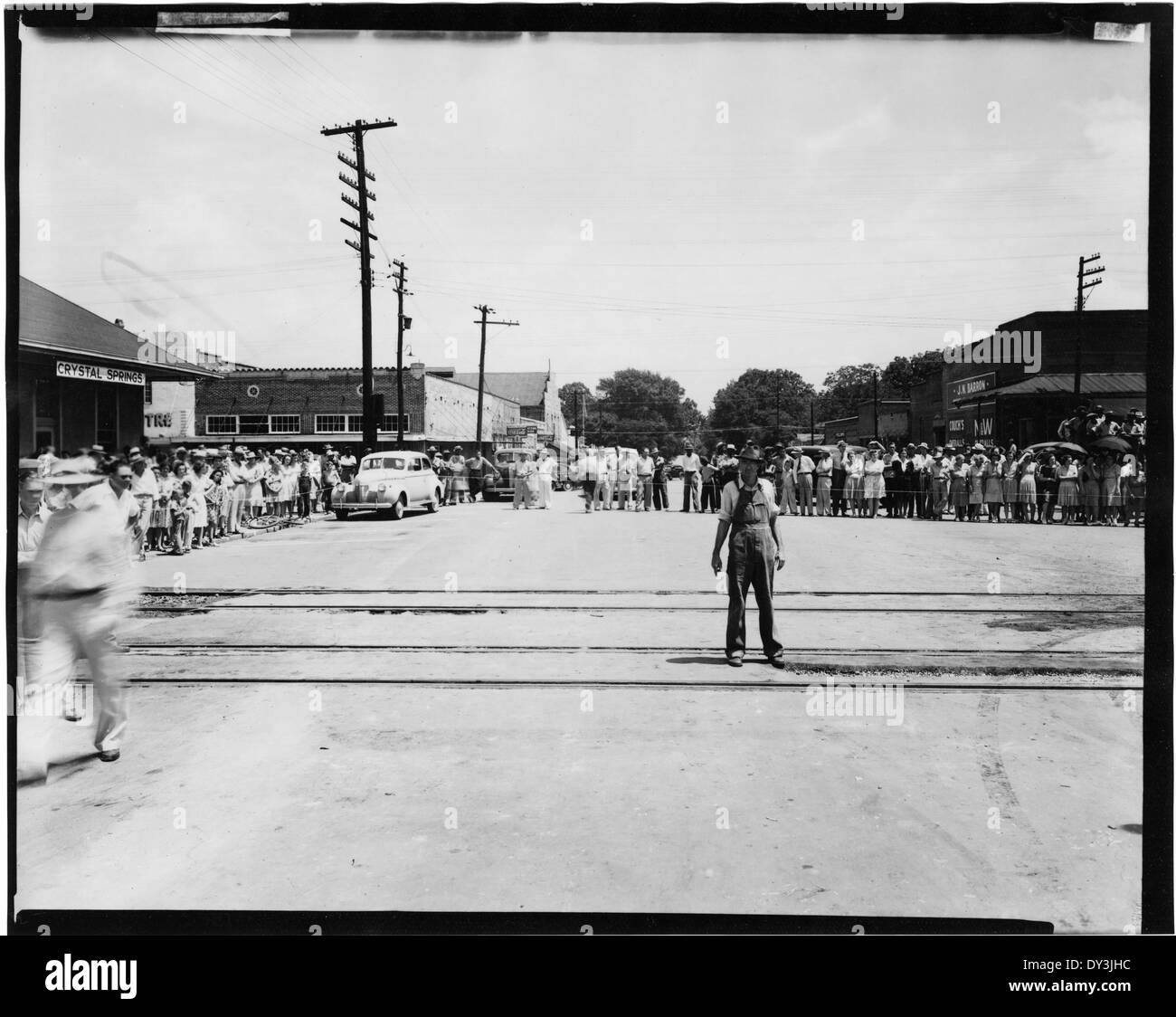 This photograph depicts a bus wreck, captured as part of a historical ...