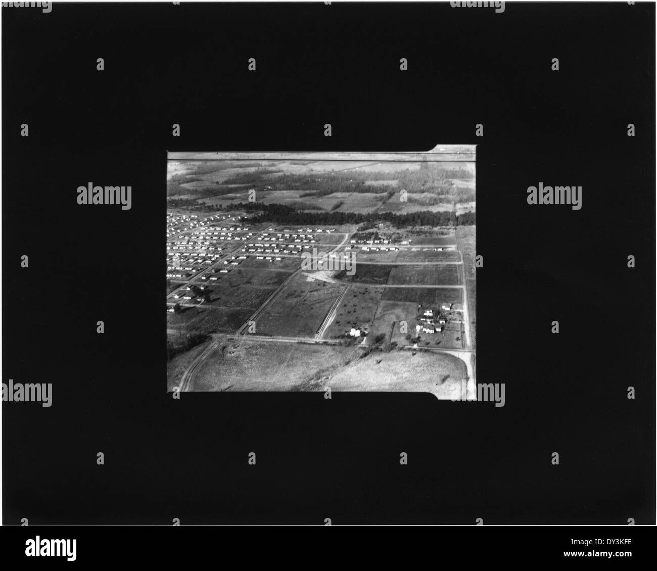 This aerial view from 1950 captures a broad perspective of a city or ...