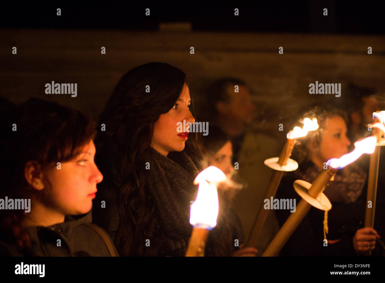 L'Aquila, Italy. 5th April, 2014. People participate in a candle rally ...