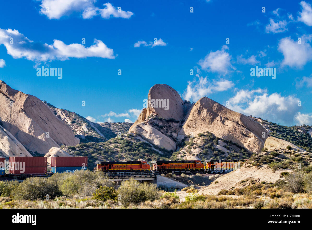 A BNSF railroad container train at the Mormon Rocks in the Cajon Pass ...