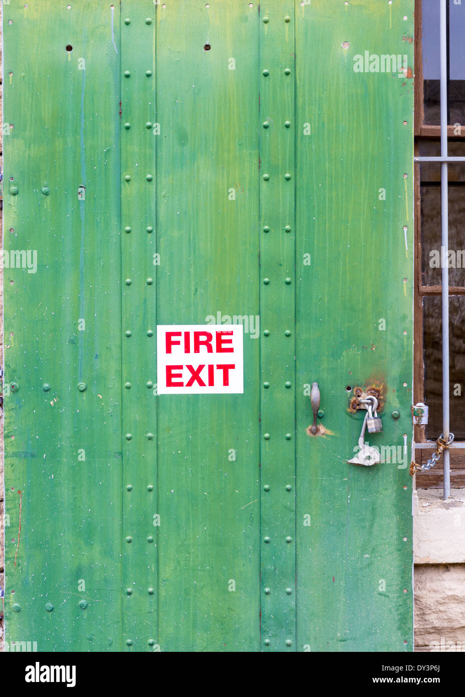 Fire door exit painted green Stock Photo - Alamy