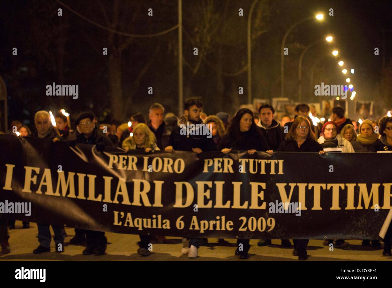 L'Aquila, Italy. 5th April, 2014. People participate in a candle rally ...