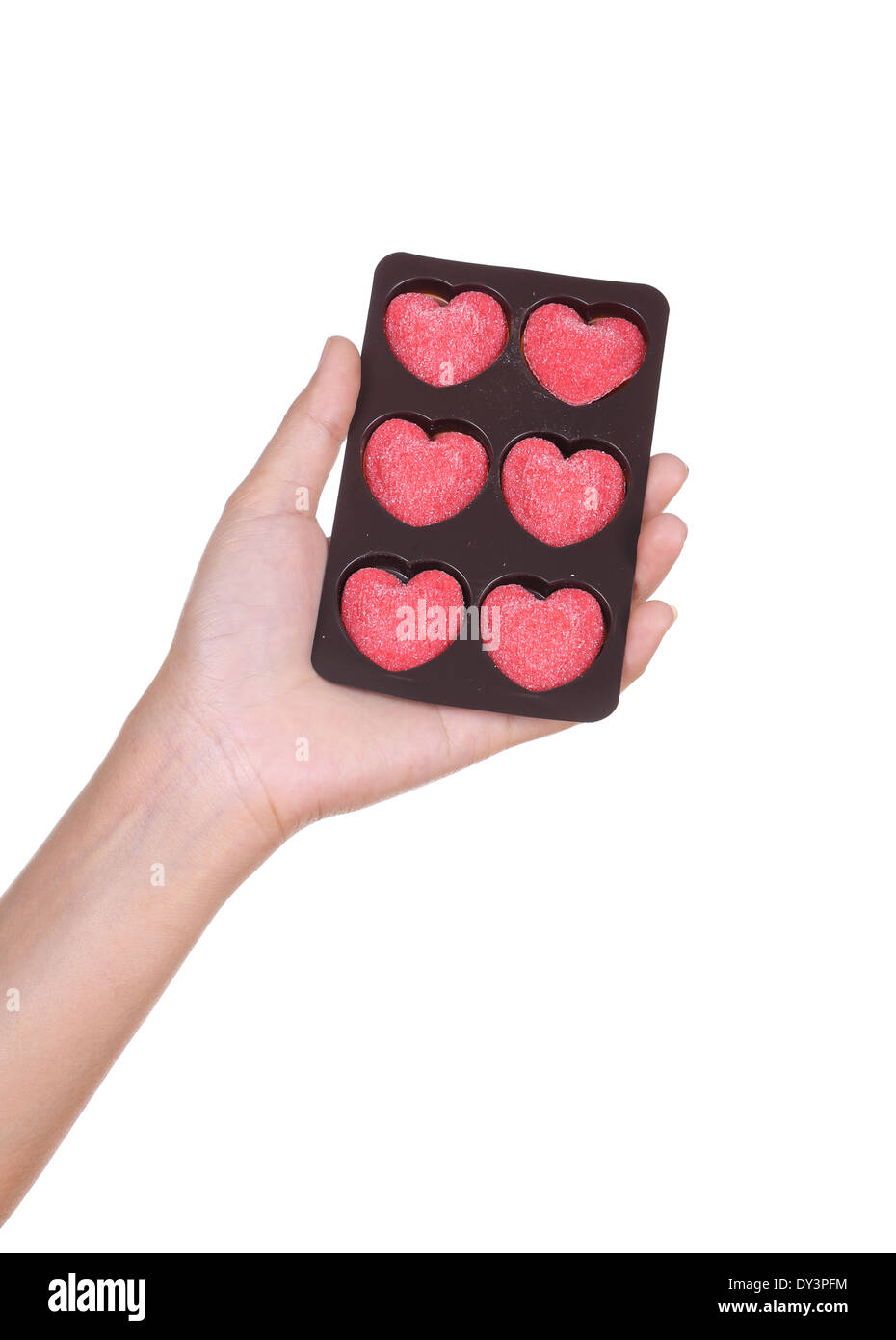 hands holding heart candy isolated on white background Stock Photo - Alamy
