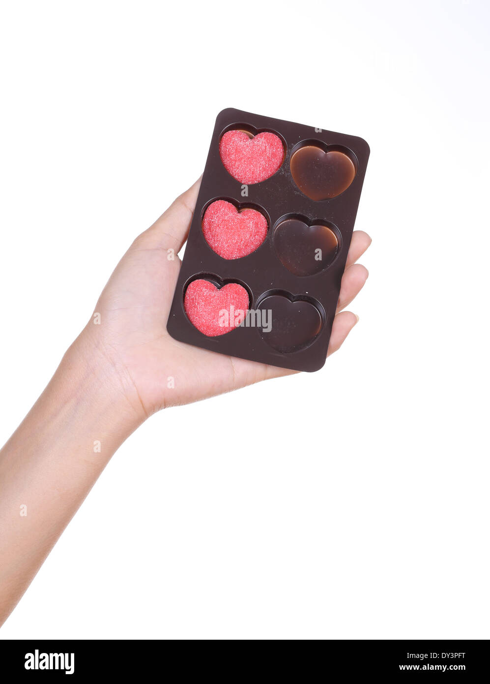 hands holding heart candy isolated on white background Stock Photo - Alamy