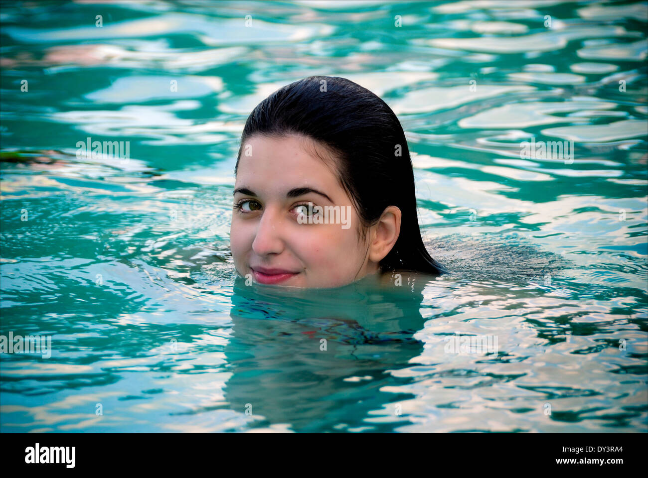 A pretty girl in a swimming pool Stock Photo - Alamy