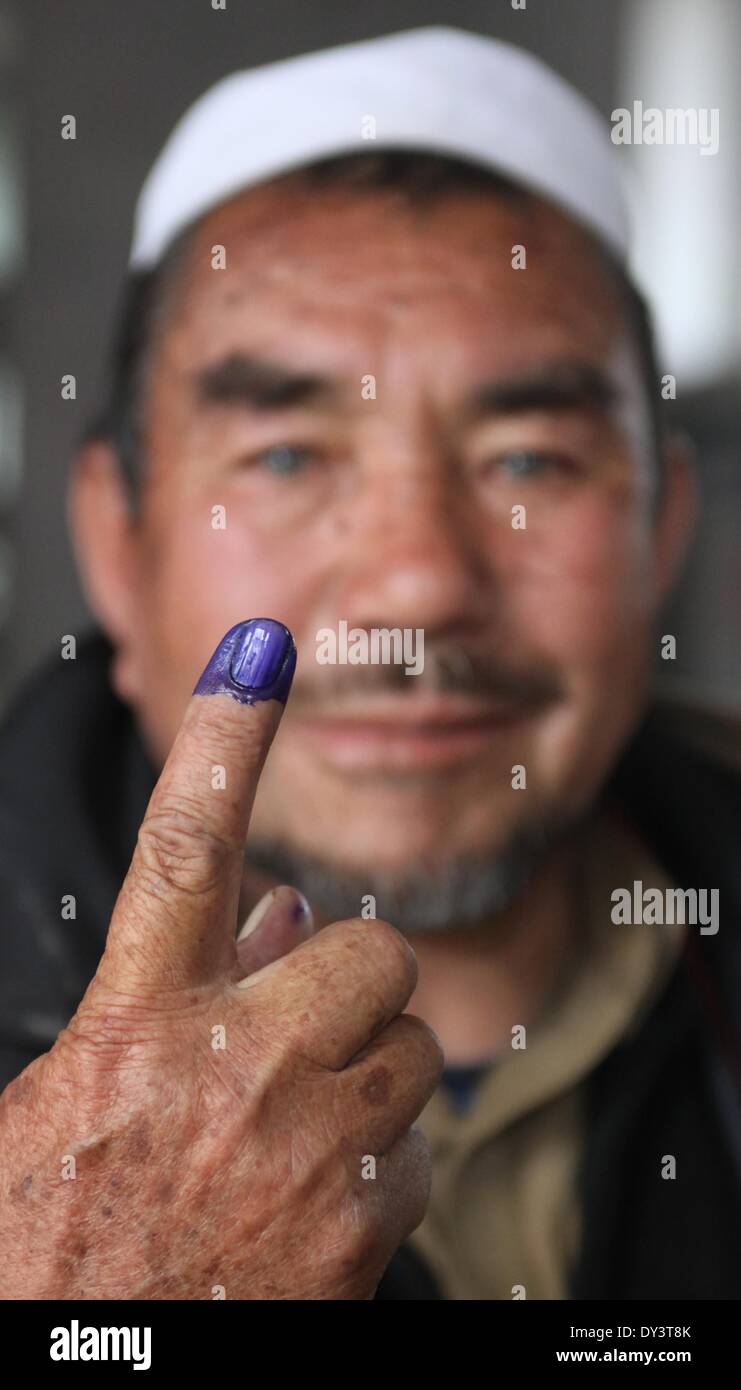 Kabul, Afghanistan. 5th Apr, 2014. An Afghan man shows his inked finger ...
