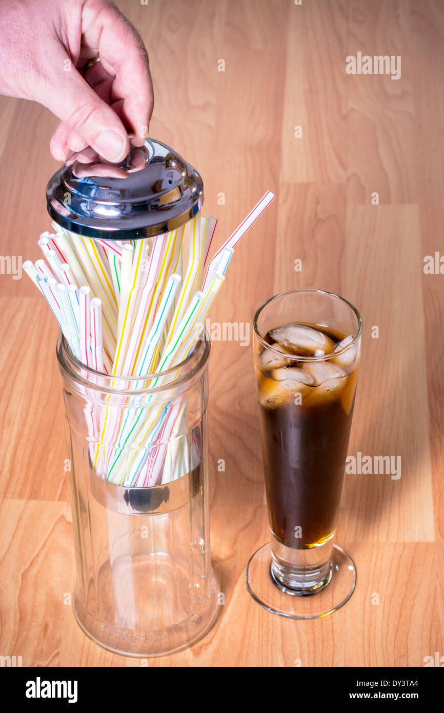 Glass of cola and straws Stock Photo - Alamy