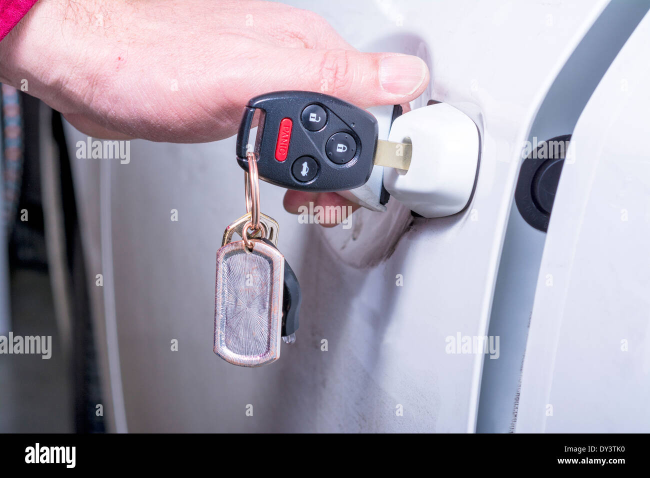 Opening a car door with a key Stock Photo - Alamy
