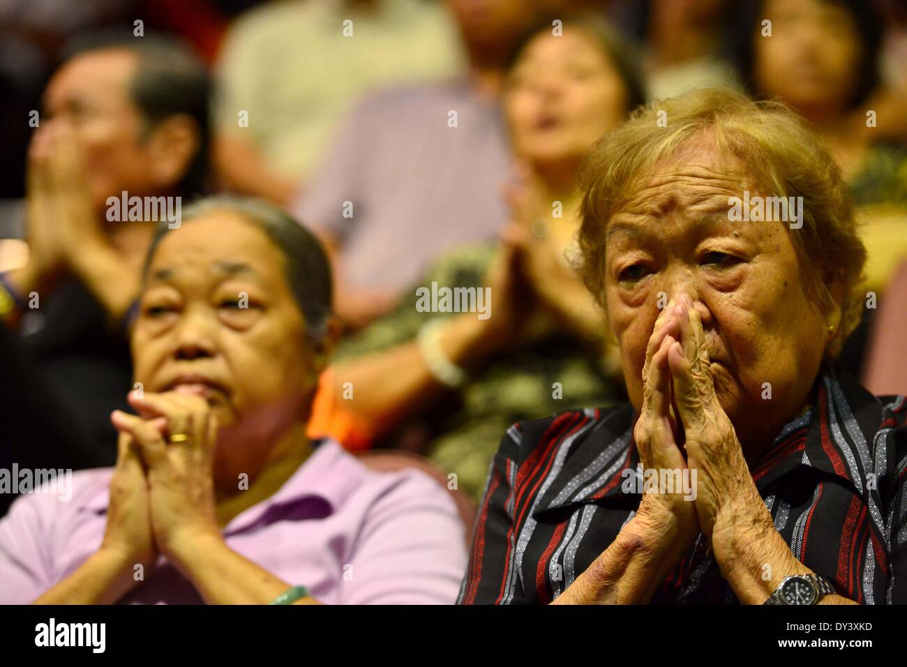 Kuala Lumpur, Malaysia. 6th Apr, 2014. Participants pray for passengers ...
