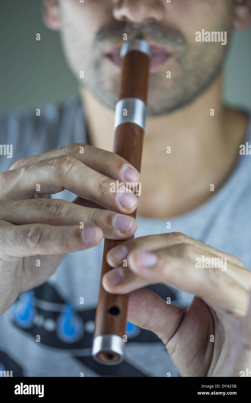 Wooden flute player hi-res stock photography and images - Alamy