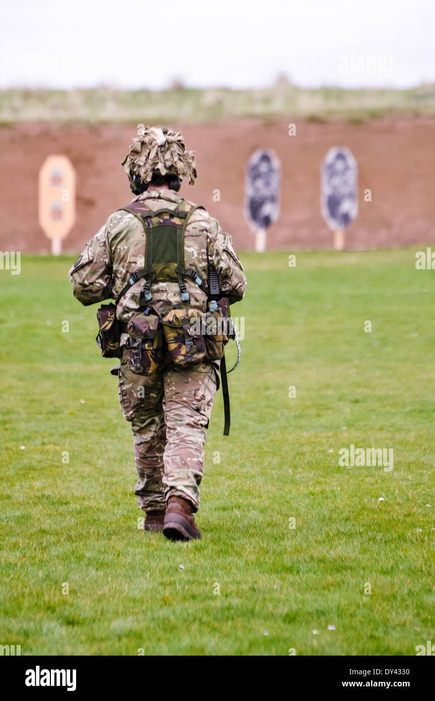 A Soldier From The British Army Walks Up To The Targets On A Military