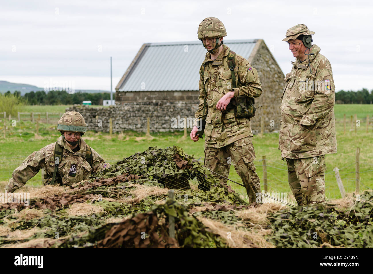 Soldiers enter a forward observation post in a rural location of Stock ...