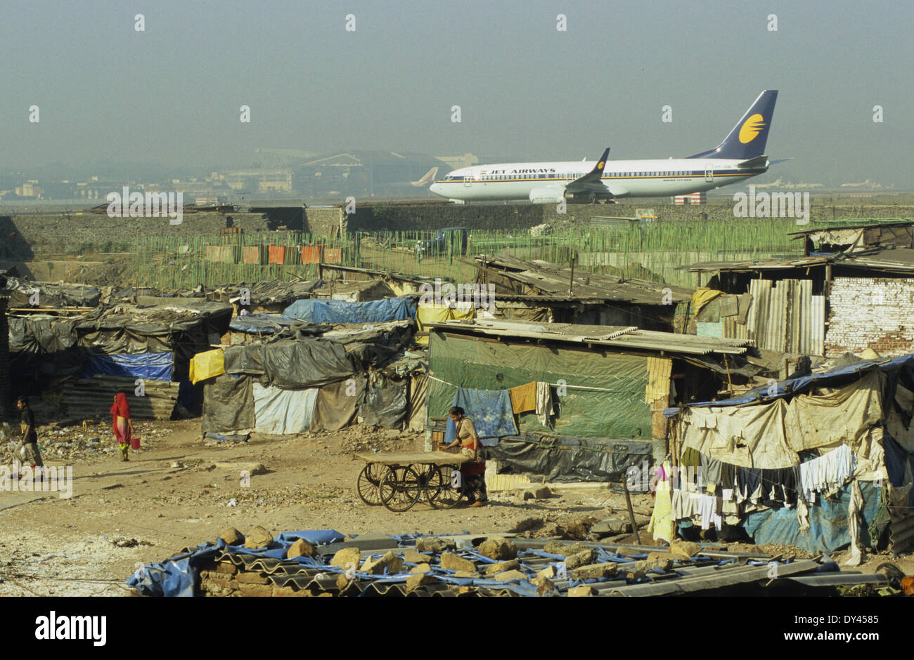 INDIA Mumbai, contrast poverty, slum huts close to the runway of Sahar ...