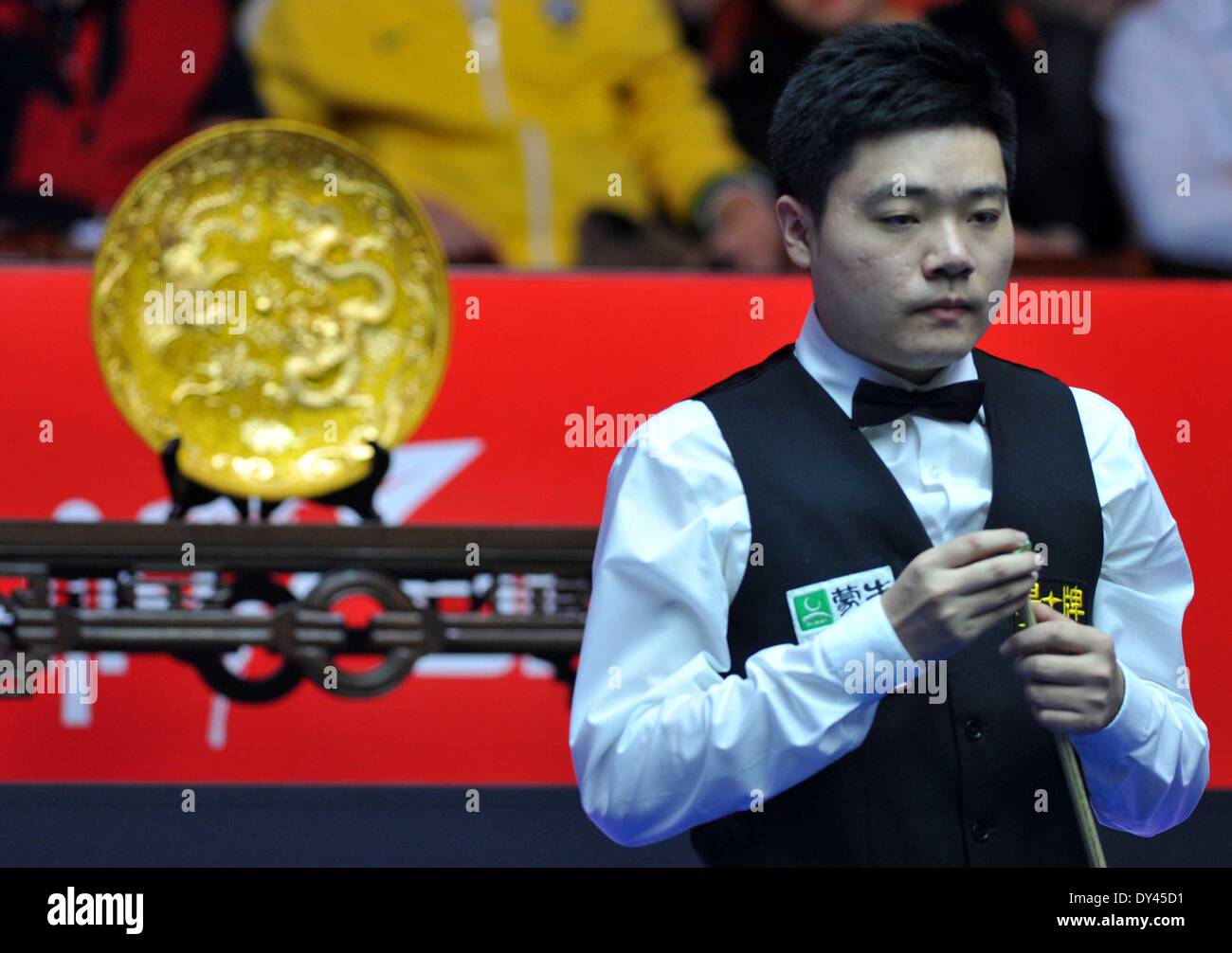 Beijing, China. 6th Apr, 2014. Ding Junhui of China ponders during the ...