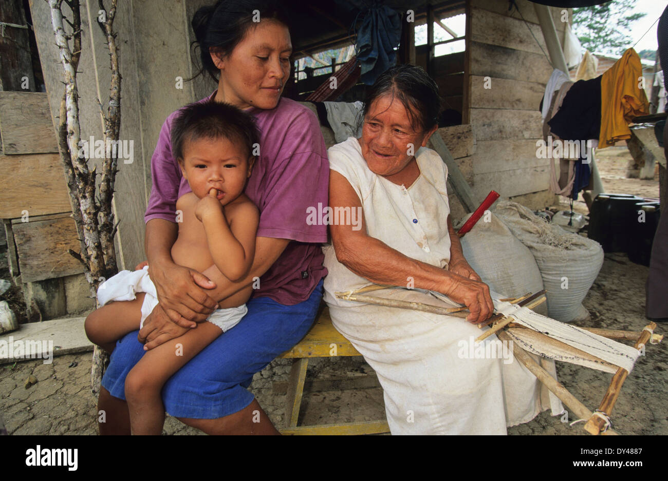 Macuxi indians , grandmother weaving with family. Roraima Province ...