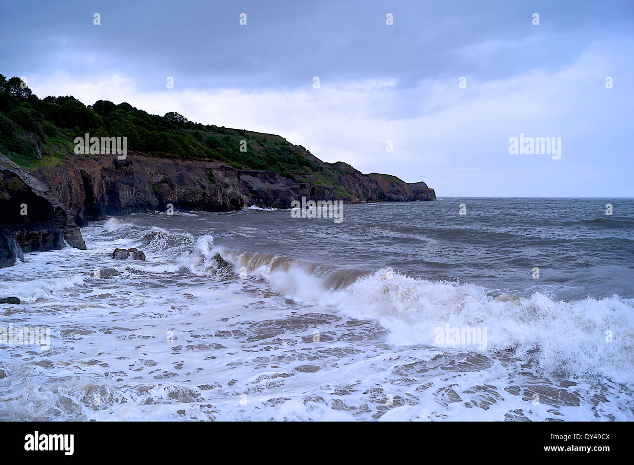 Waves crashing on the beach Stock Photo - Alamy