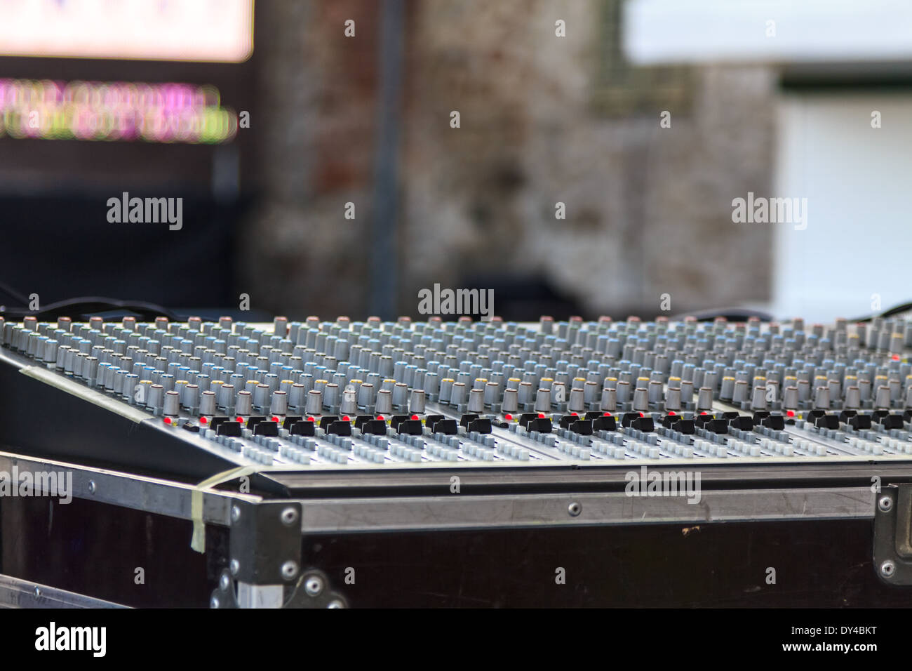 A mixing console in front of a stage Stock Photo - Alamy