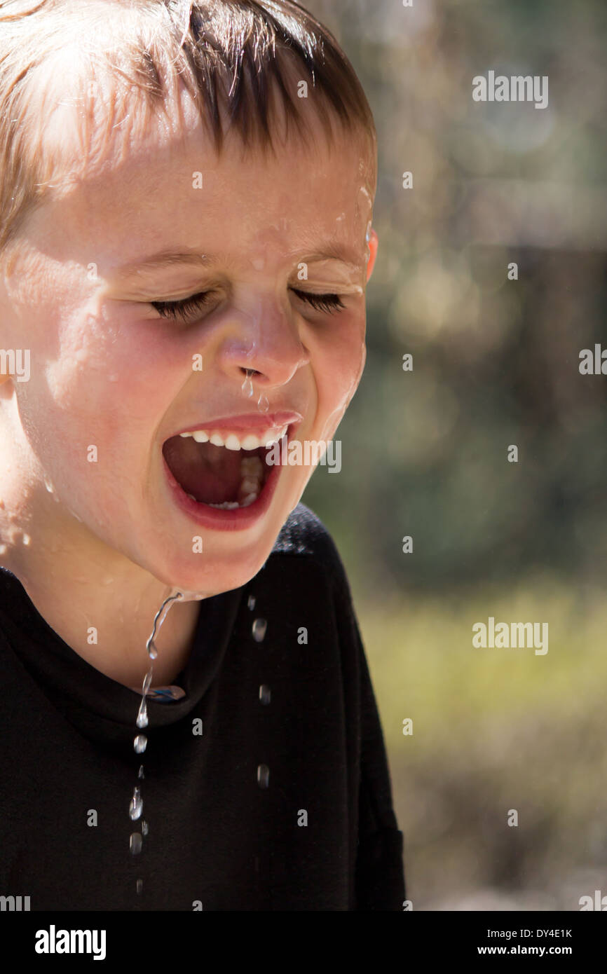 Soaking wet child hi-res stock photography and images - Alamy