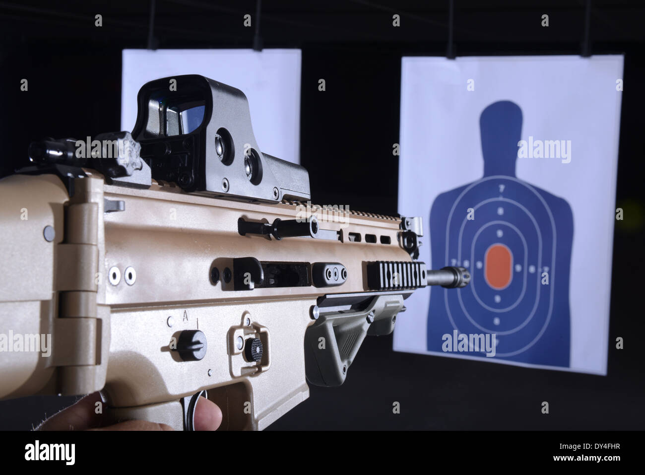 firearm or machine gun pointed at bullseye target on gun range Stock ...
