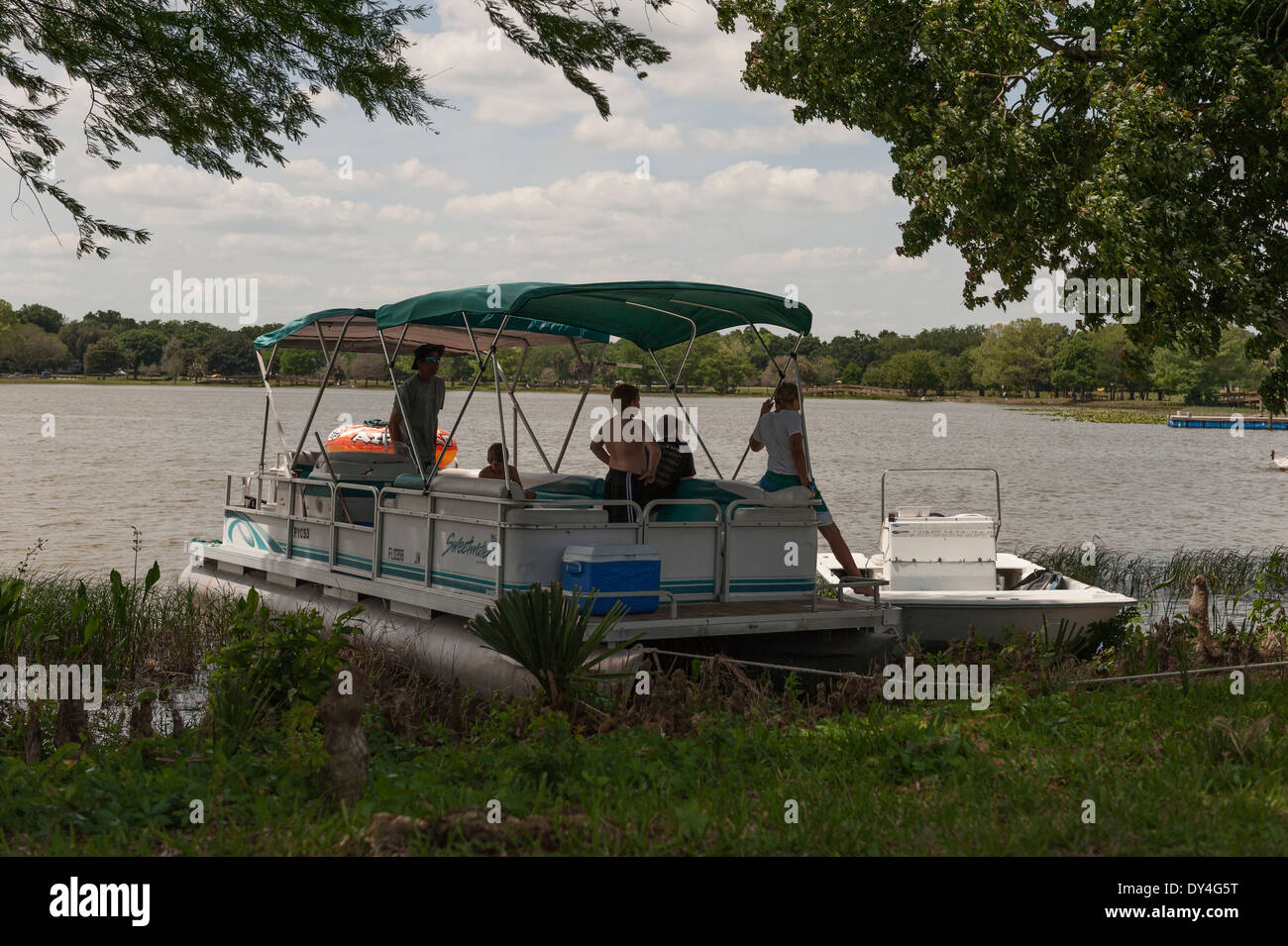 A family out in there Pontoon boat on Lake Harris in Central Florida ...