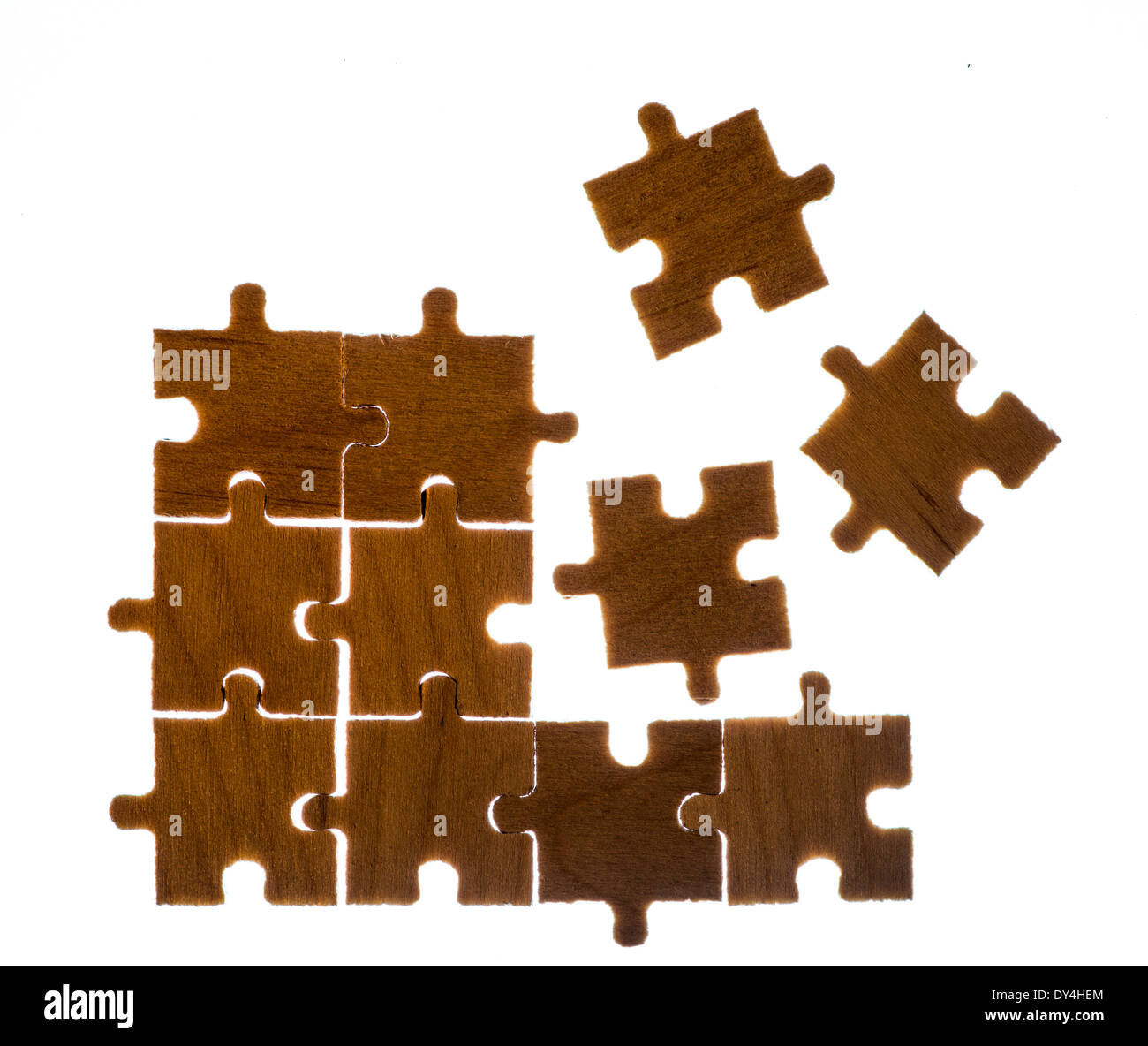 Wooden puzzle and backlight background. Close up Stock Photo - Alamy