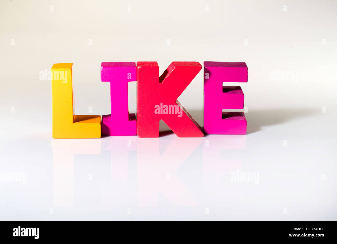 Multicolored text like made of wood. White background Stock Photo - Alamy