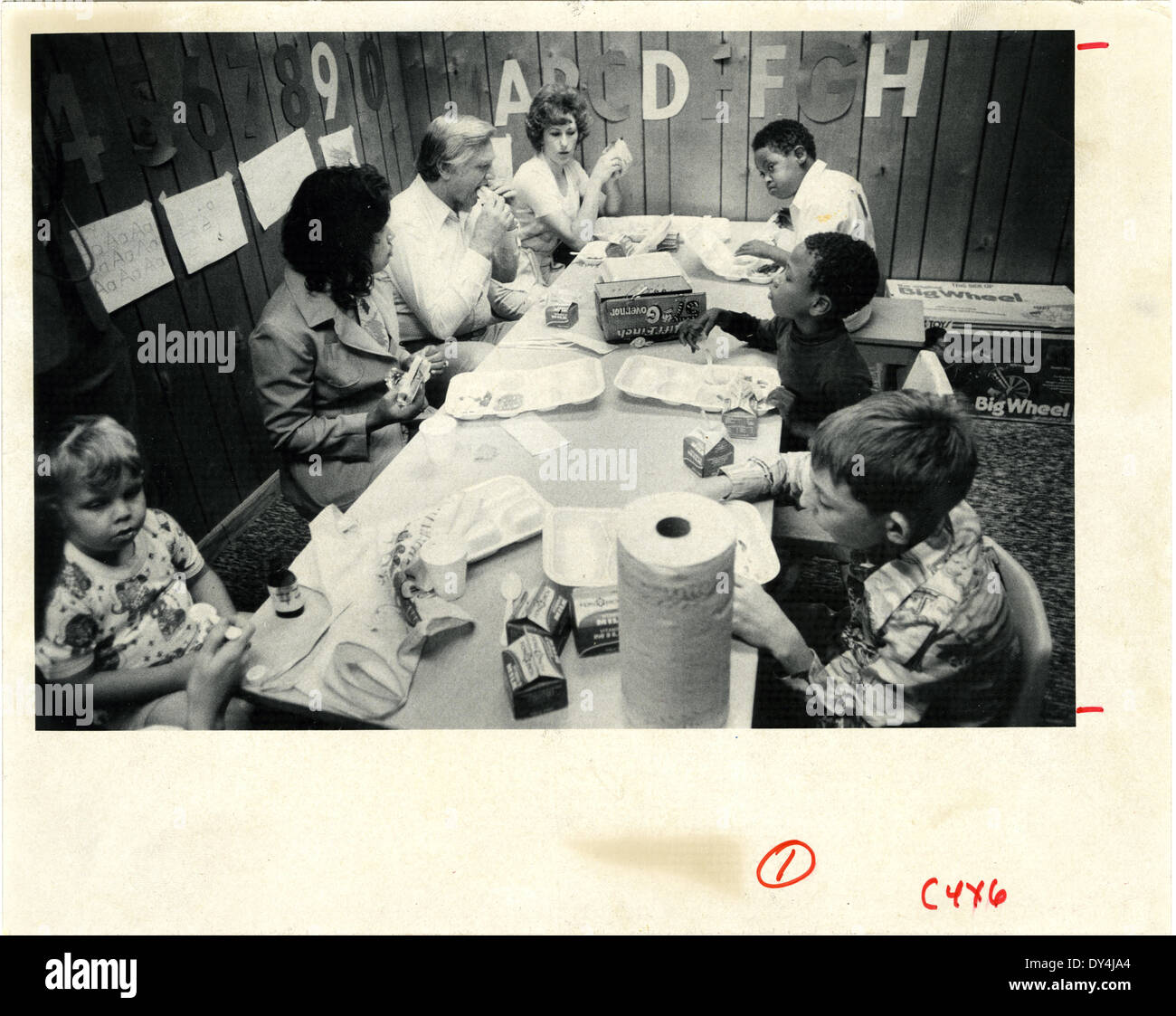 Governor Cliff Finch is shown dining with school children in ...