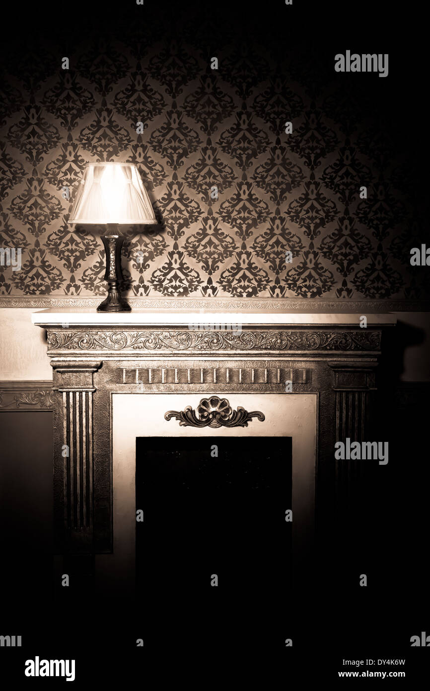 Beautiful old lamp on fireplace in red vintage room Stock Photo - Alamy