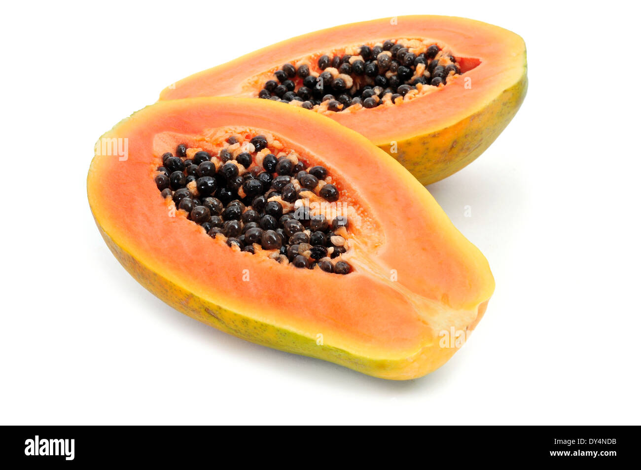 a halved papaya on a white background Stock Photo - Alamy
