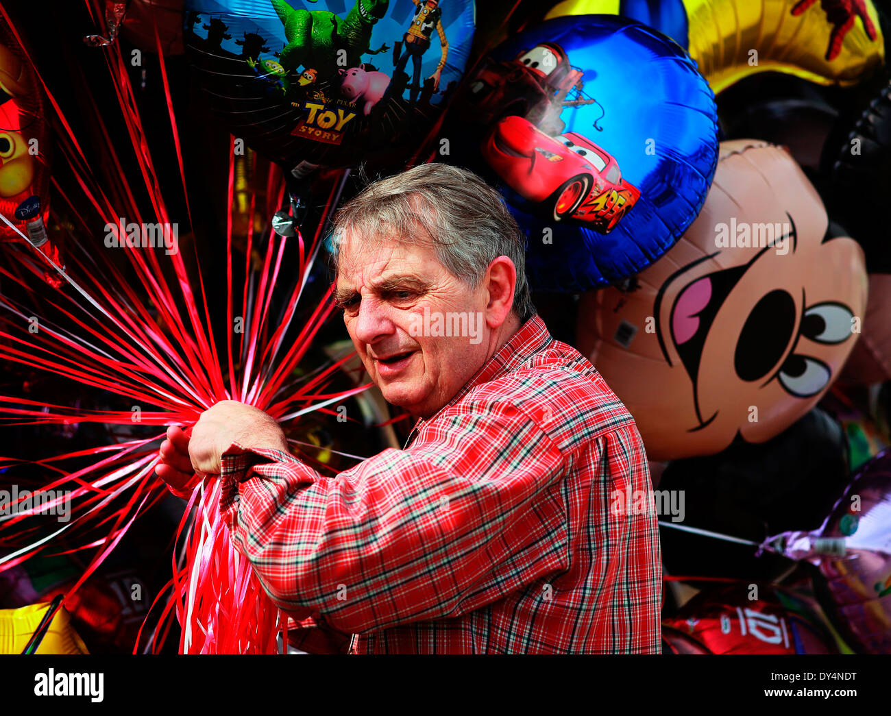 Man selling balloons hi-res stock photography and images - Alamy